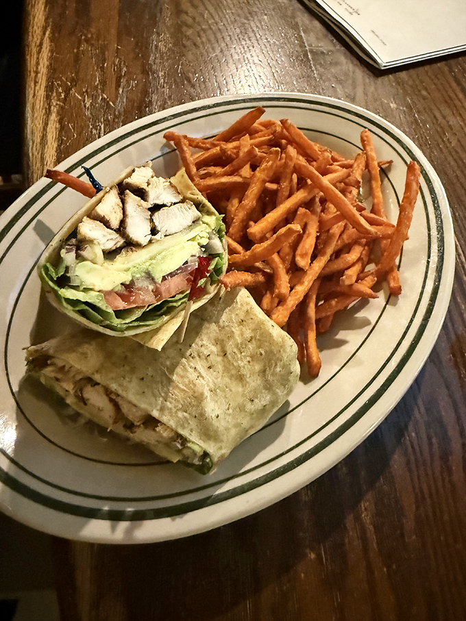 Wrap star alert! This Caesar chicken wrap, with its crispy companion of sweet potato fries, is ready for its close-up.