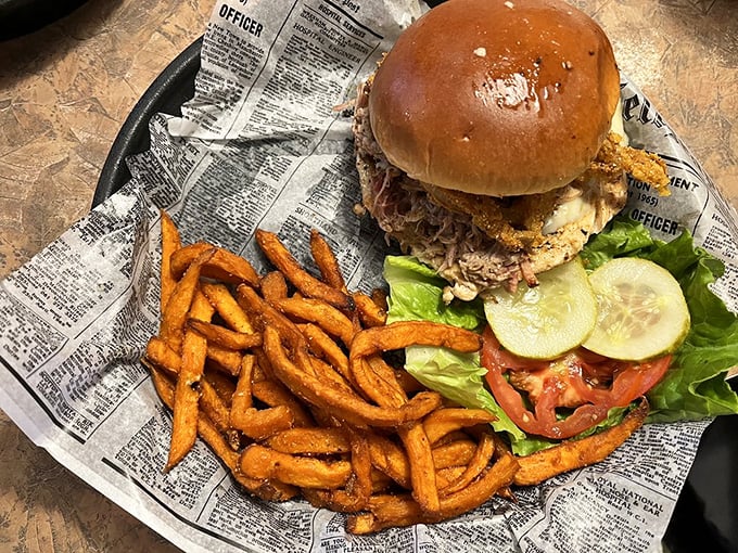 Sandwich perfection! This Cajun chicken creation is stacked higher than a Jenga tower, with fries that could make a Southerner weep with joy.