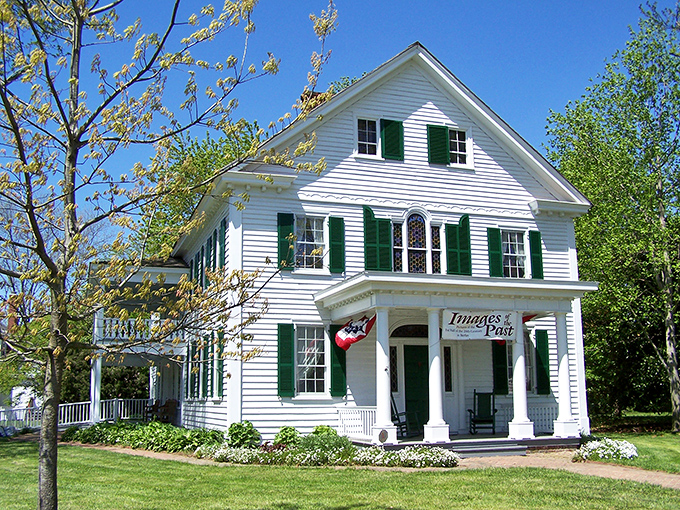 The pristine white Colonial architecture of Images Past stands as Berlin's elegant time machine, where history looks better maintained than most of our retirement plans.