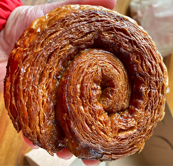 Cardamom roll or edible work of art? This golden, flaky masterpiece is ready for its close-up &ndash; and your eager taste buds.