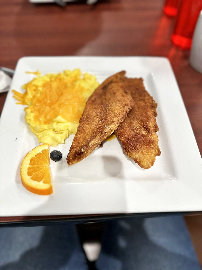 Golden-brown perfection meets sunshine on a plate. This catfish and eggs combo is like a good morning hug for your taste buds.