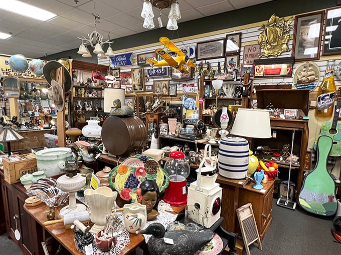 Ceramic heaven or your grandma's china cabinet? This display is a mismatched masterpiece of vintage plates, figurines, and that one creepy clown you can't stop staring at.