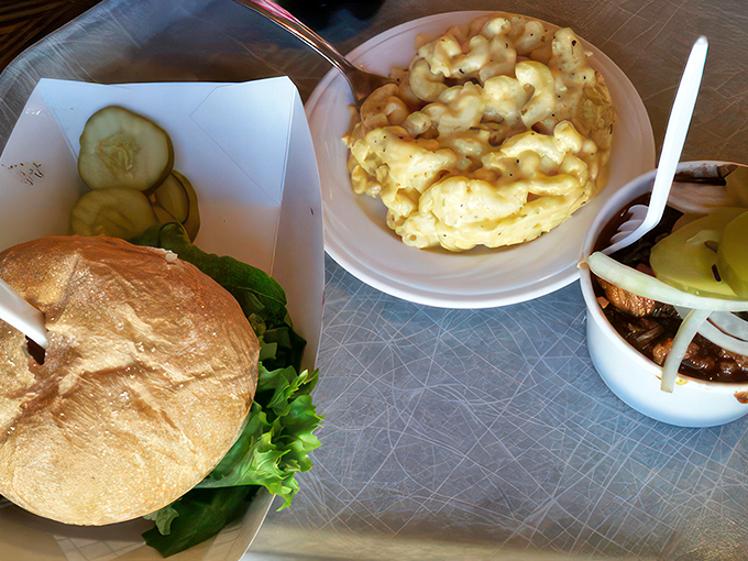 A trifecta of temptation: juicy cheeseburger, creamy mac and cheese, and a cup of pulled pork that's music to your taste buds.