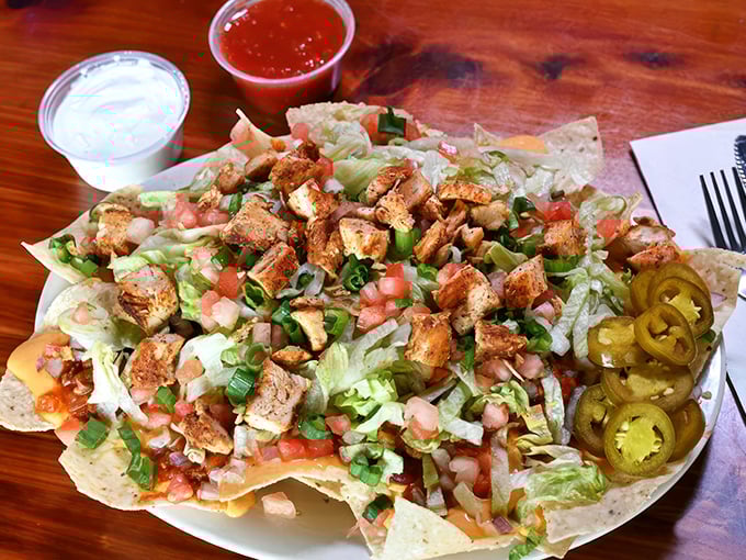 Nachos that defy gravity and common sense. It's like a Jenga tower of Tex-Mex goodness – pull carefully!