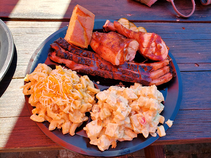 The holy trinity of barbecue. Ribs, chicken, and sides create a plate that's less a meal and more a religious experience.