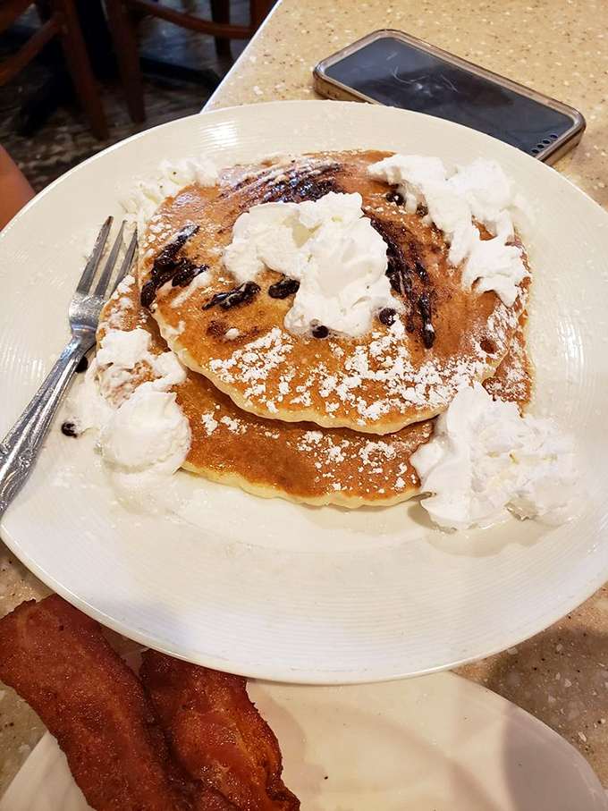Chocolate for breakfast? Don't mind if I do! These fluffy pancakes are like a warm hug for your taste buds, topped with a dollop of pure joy.
