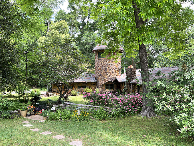 Garden of earthly delights! This flower-filled oasis surrounding a quaint cottage would make even Mother Nature green with envy.