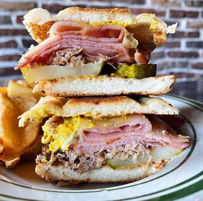 Behold the Cuban: a sandwich that's traveled further than most of us this year. Packed tighter than a suitcase, it's a tasty ticket to Havana.