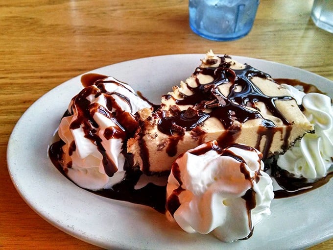 Dessert or work of art? This slice of heaven is drizzled with enough chocolate to make Willy Wonka jealous. It's not just a treat &ndash; it's a religious experience.