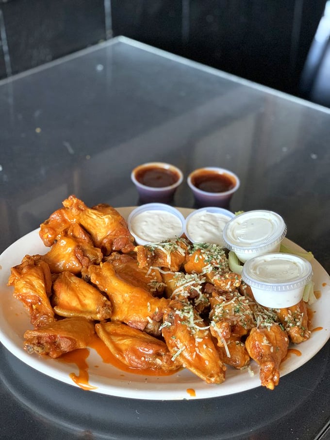 The wooden bowl presentation elevates these wings from mere appetizer to centerpiece attraction. The sauce-to-wing ratio? Absolutely perfect.