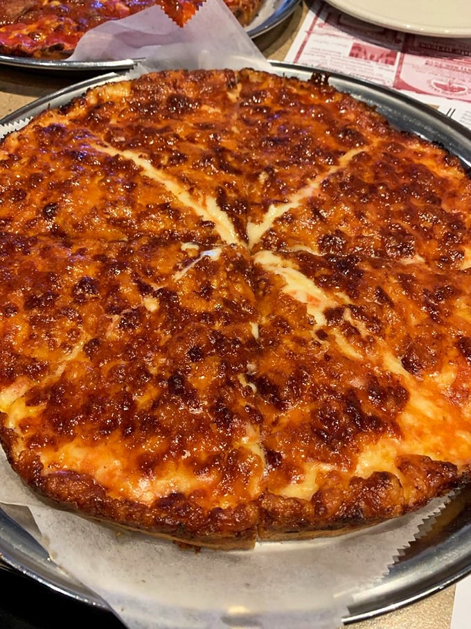 Double the cheese, double the fun! This pie is stretching the limits of dairy deliciousness, one gooey bite at a time.