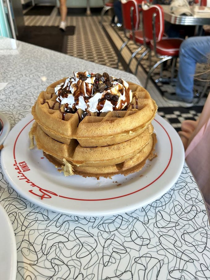 Waffle tower of power! This stack is taller than my childhood dreams of becoming a rockstar. Time to dive in!