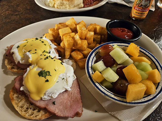 Eggs Benedict gets a Midwest makeover! Tender ham, perfectly poached eggs, and hollandaise sauce atop... is that an English muffin?