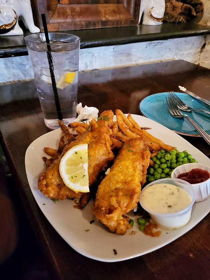 Golden-battered fish that shatters like delicate glass, revealing steamy perfection within&mdash;your British ancestors would approve.