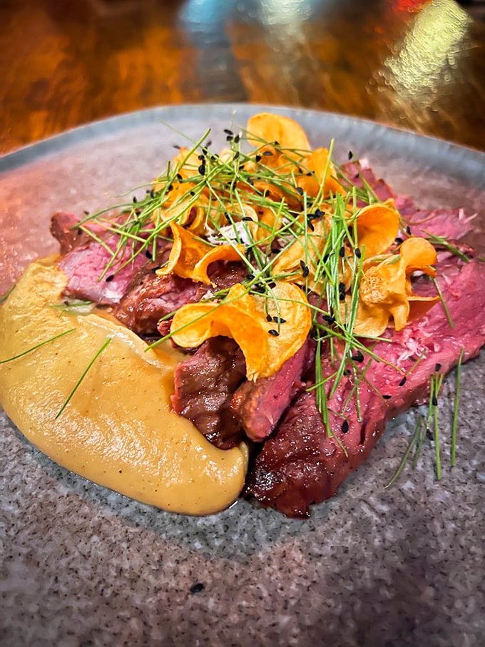 Medium-rare perfection meets artistic presentation. This steak and puree combo is what food dreams are made of.