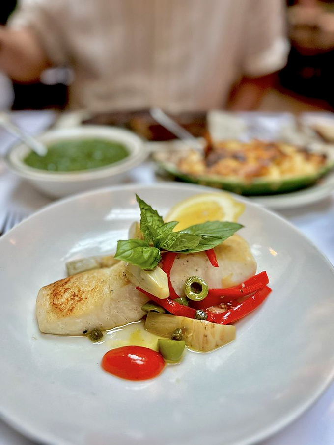 Even seafood gets the royal treatment&mdash;this halibut's delicate flesh contrasts with vibrant peppers and olives in a Mediterranean love letter.