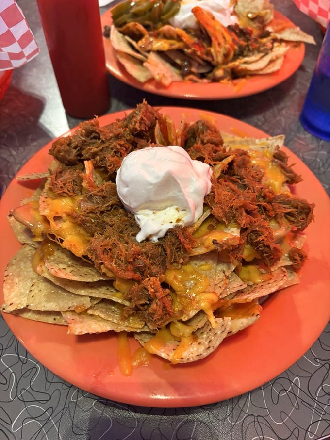 Aloha, flavor explosion! These Kalua Pork Nachos are what happens when Hawaii and Mexico have a delicious love child.