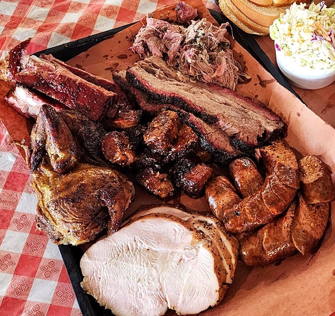 This tray isn't just dinner; it's a celebration on butcher paper. Every meat group represented, like a United Nations of barbecue diplomacy.