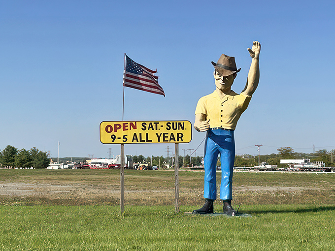 The towering "Muffler Man" stands guard like a blue-jeaned Paul Bunyan, silently announcing "bargains this way" to passing motorists on Route 63.