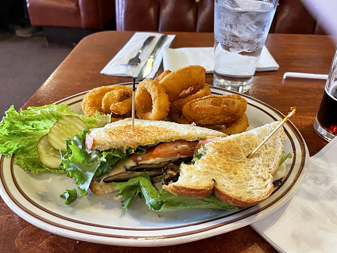 Mushroom Swiss burger meets onion rings &ndash; a duo more iconic than Batman and Robin. It's comfort food with a crispy twist!