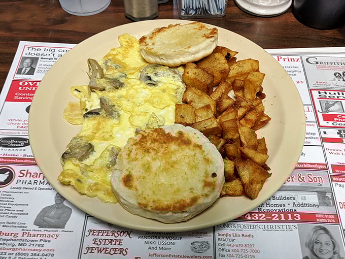 This omelet's got more folds than an origami convention. Paired with those golden home fries, it's a breakfast that means business.