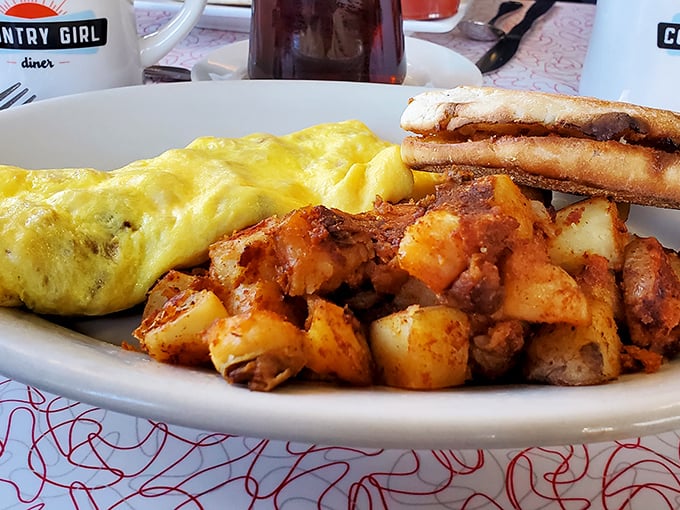 The omelet whispers "fluffy" while those home fries practically shout "crispy!" This plate is the breakfast equivalent of winning the lottery.
