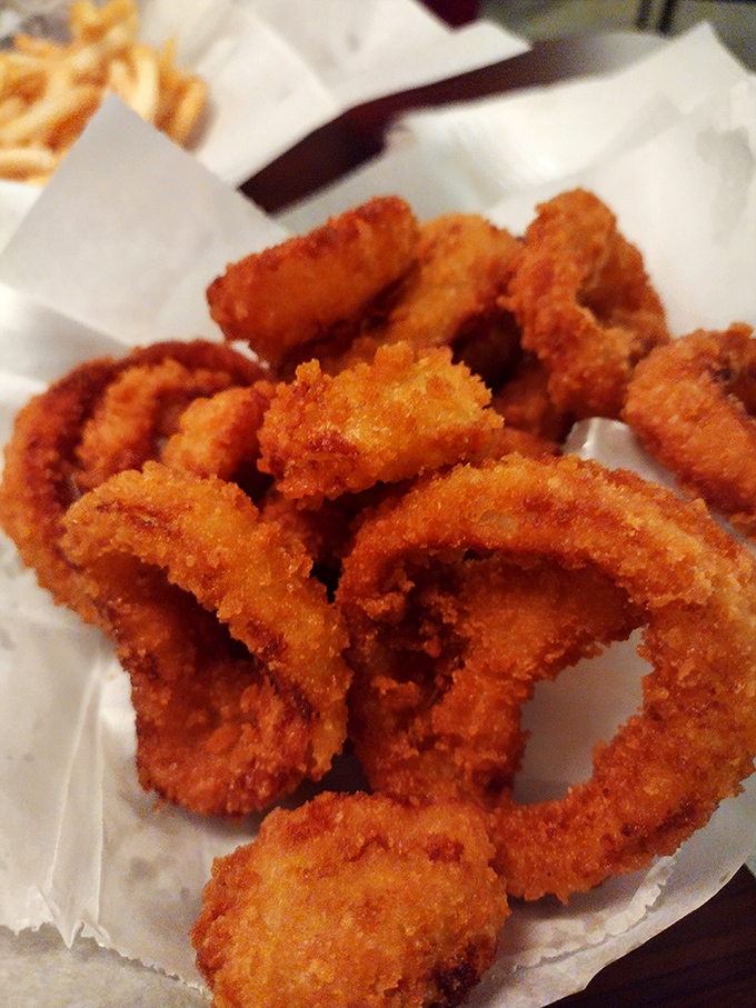 Golden rings of happiness! These onion rings aren't just a side dish, they're crispy halos of flavor that deserve their own fan club.