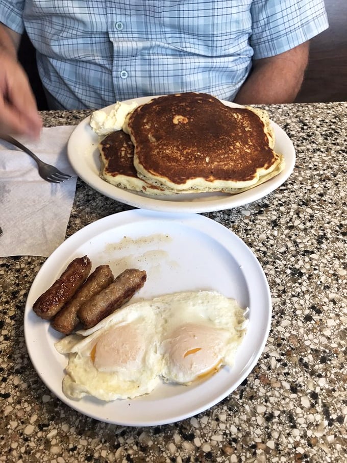 Pancakes as big as your dreams! Paired with eggs and sausage, it's a breakfast trifecta that would make Ron Swanson proud.