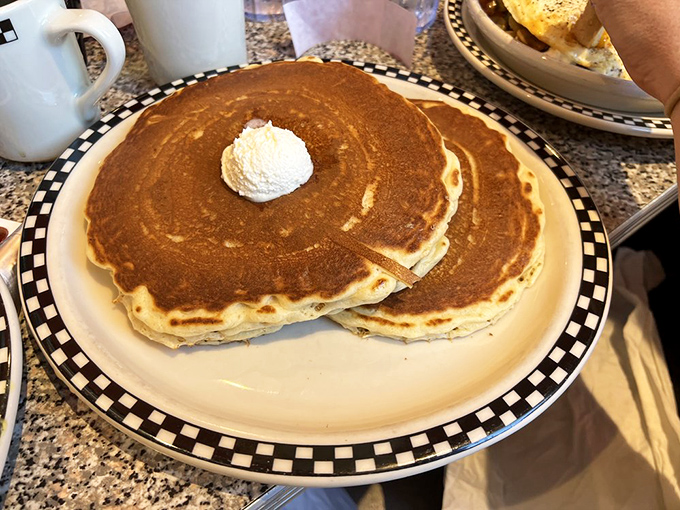Pancake perfection! These golden discs of joy are so fluffy, they might float away if not for that dollop of butter.