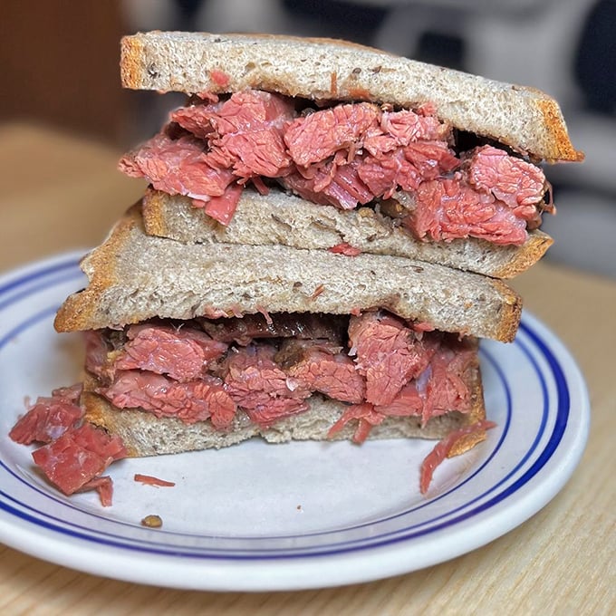 Pastrami perfection! Each bite is a flavor explosion that'll transport you straight to deli heaven. No passport required, just a hearty appetite!