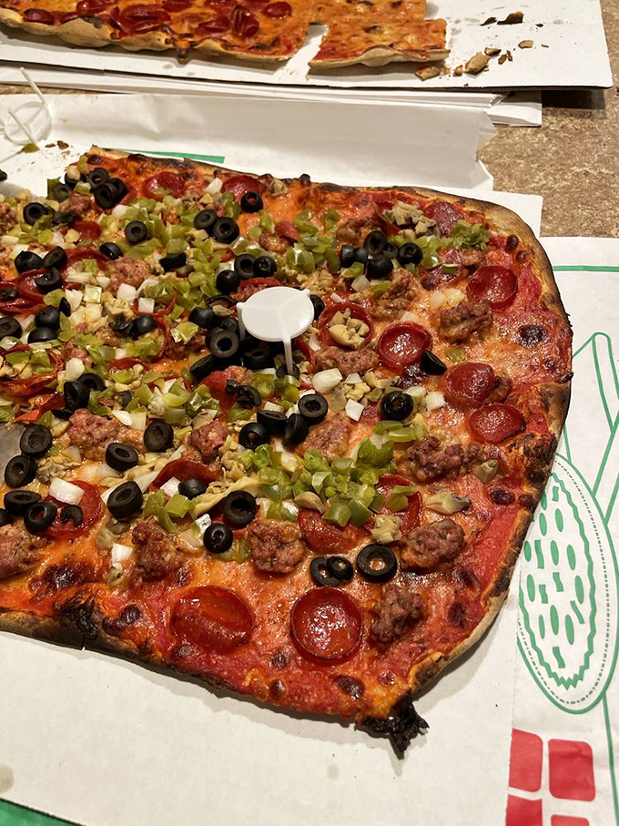 The Pepperoni Supreme: where meat lovers' dreams come true! This pizza is so loaded, it could double as a weightlifting exercise for your fork.