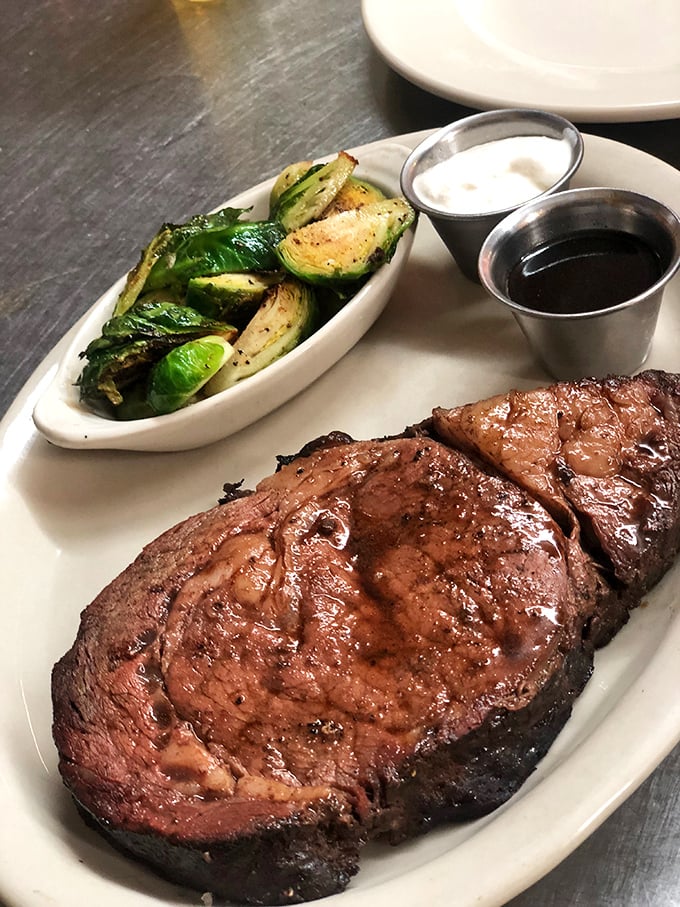 This prime rib is so perfectly cooked, it could make a vegetarian weep. The marbling is like a delicious roadmap to flavor town, and that crust? Chef's kiss!