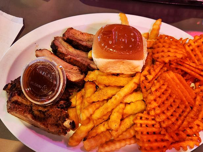 Smoky ribs and crispy fries: a match made in comfort food heaven. This plate's got more curves than a country road, and it's just as satisfying.