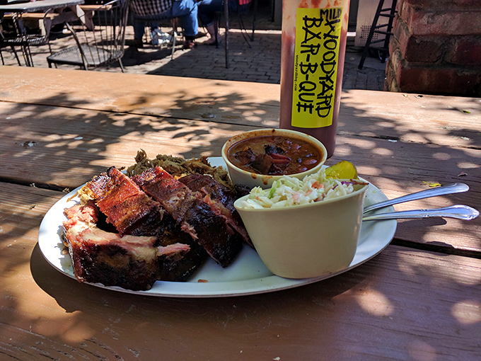 A plate that would make Fred Flintstone jealous! Ribs, sides, and pickles &ndash; oh my! It's a carnivore's dream come true.