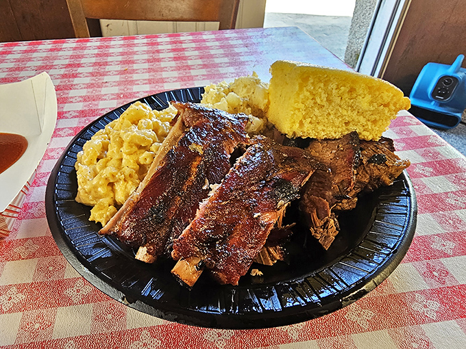 Comfort food trifecta! Golden cornbread and creamy mac 'n' cheese cozy up to ribs that fall off the bone with a wink.