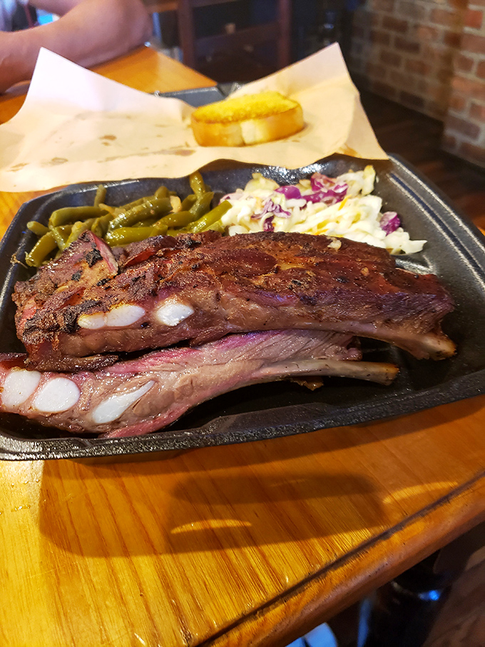 A perfect trifecta: ribs, mac and cheese, and slaw. It's like the Avengers of comfort food, assembled on one plate.