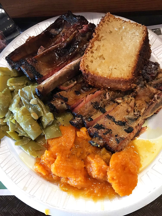 A complete Southern symphony on a plate &ndash; ribs, cornbread, green beans, and sweet potatoes playing perfect harmony.