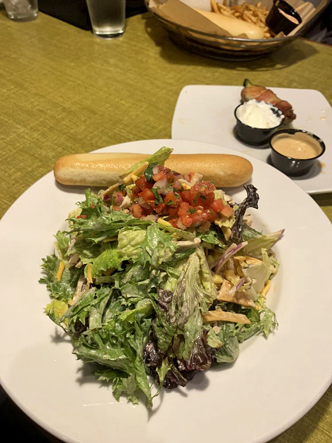 Fresh, vibrant, and unapologetically green&mdash;this house salad isn't just a side dish, it's the perfect counterpoint to all that glorious cheese.