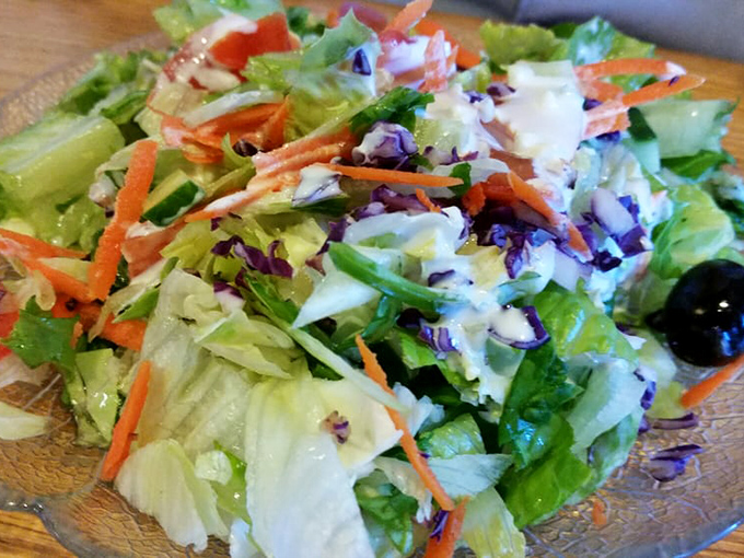 A salad that actually looks like it was made by someone who cares, with vegetables that probably had names and good upbringings.
