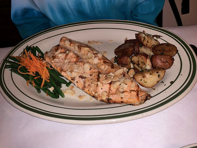 Salmon so perfectly grilled, it might just swim upstream to your plate. Don't forget the lemon!