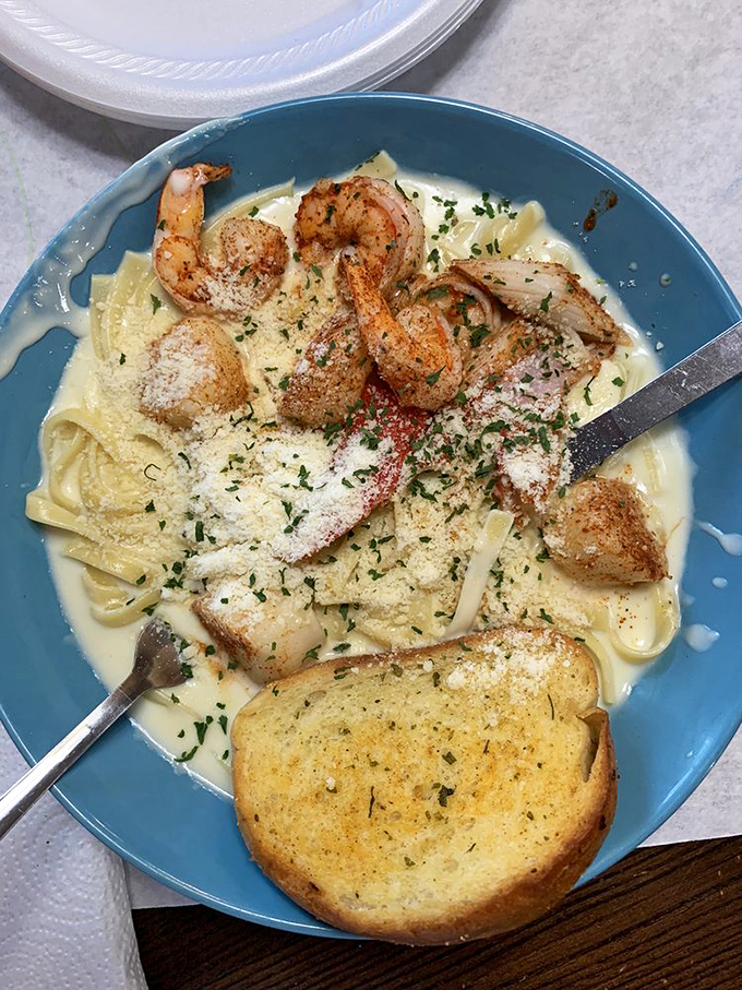 Pasta meets the sea! This creamy seafood pasta is like a mermaid's dream come true, complete with garlic bread life raft.