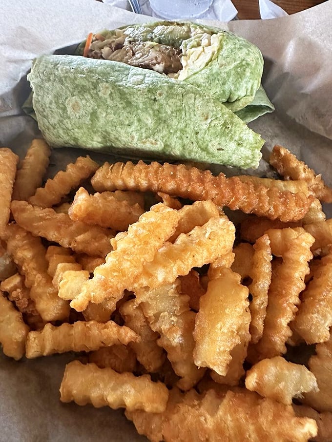 Talk about a wrap star! This seafood wrap and crispy fries combo is the culinary equivalent of a beach vacation in every bite.