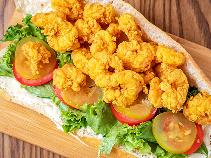 A po'boy that's anything but poor in the flavor department. Golden fried shrimp nestled on fresh lettuce and tomato&mdash;Louisiana comfort on bread.