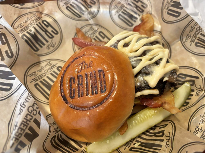 The Grind stamps their logo right onto the bun&mdash;a burger so confident in its deliciousness, it literally brands itself.
