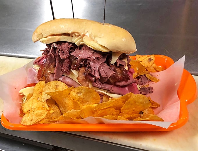 Behold, the leaning tower of deliciousness! This skyscraper sandwich defies gravity and tantalizes taste buds in equal measure.