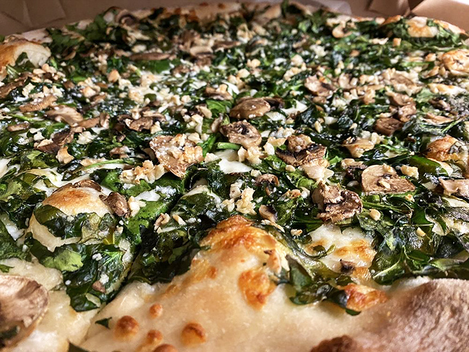 Green machine dream! This spinach, garlic, and mushroom pizza is so fresh, it might start photosynthesizing on your plate.