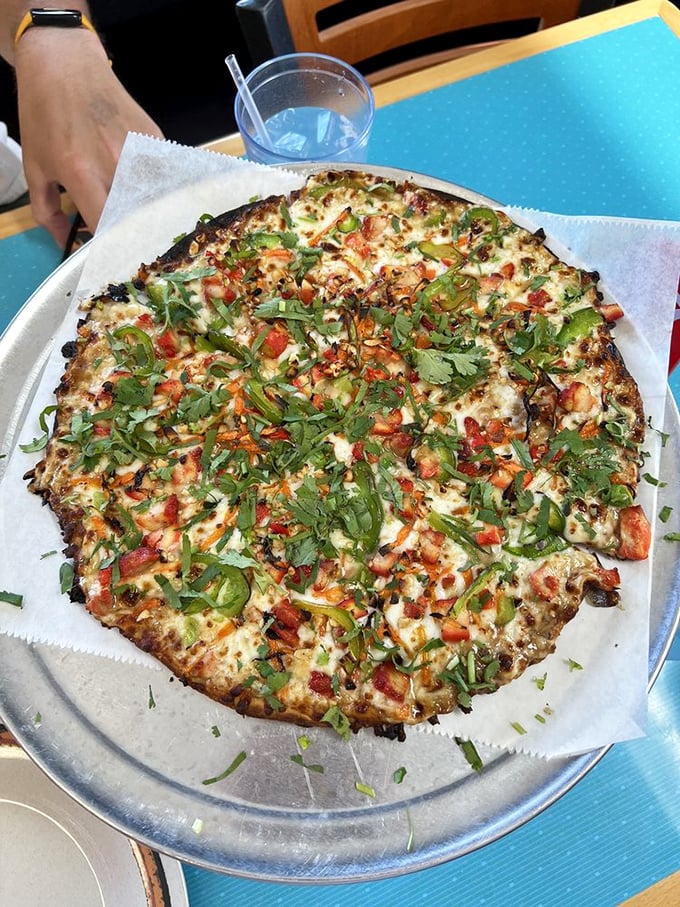 East meets West, and your taste buds win! This Thai Peanut pizza is like a passport for your palate, no plane ticket required.