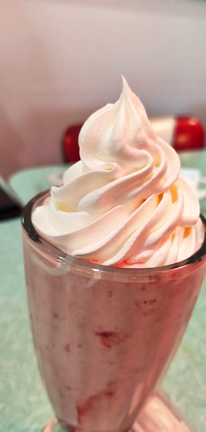 Whipped cream mountain ahoy! This shake's snowy peak would make Sir Edmund Hillary proud. Time to conquer it with a spoon (or straw).