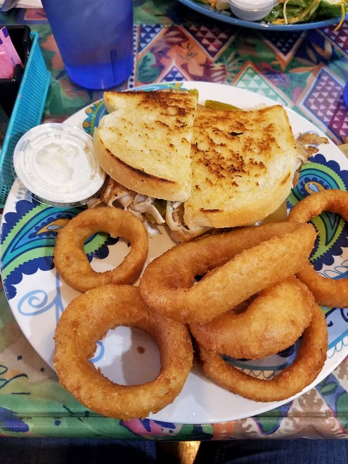 These onion rings aren't just side dishes&mdash;they're golden halos of happiness accompanying a sandwich that means business.