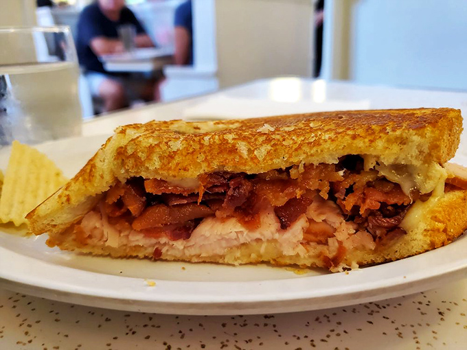 Sandwich perfection! This turkey bacon melt is stacked higher than my college debt, but infinitely more satisfying to tackle.